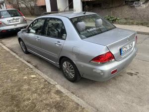 Grey Mitsubishi Lancer 2004 in Vilnius, with an engine capacity of 1.60 L and mileage of 149 thousand km for 850 €, photo 4 on AUTOMOTO.COM.LV
