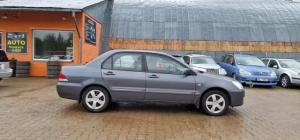 Grey Mitsubishi Lancer 2005 in Valmiera, with an engine capacity of 1.60 L and mileage of 316 thousand km for 1400 €, photo 3 on AUTOMOTO.COM.LV