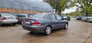 Grey Mitsubishi Lancer 2005 in Valmiera, with an engine capacity of 1.60 L and mileage of 316 thousand km for 1400 €, photo 4 on AUTOMOTO.COM.LV