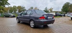 Grey Mitsubishi Lancer 2005 in Valmiera, with an engine capacity of 1.60 L and mileage of 316 thousand km for 1400 €, photo 6 on AUTOMOTO.COM.LV