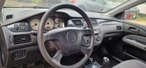 Grey Mitsubishi Lancer 2005 in Valmiera, with an engine capacity of 1.60 L and mileage of 316 thousand km for 1400 €, photo 11 on AUTOMOTO.COM.LV