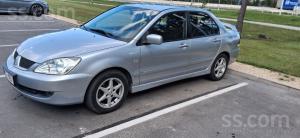 Pelēks Mitsubishi Lancer 2005 Rīga, ar dzinēja tilpumu 1.60 L un nobraukumu 180 tūkst. km par 1400 €, foto 4 vietnē AUTOMOTO.COM.LV