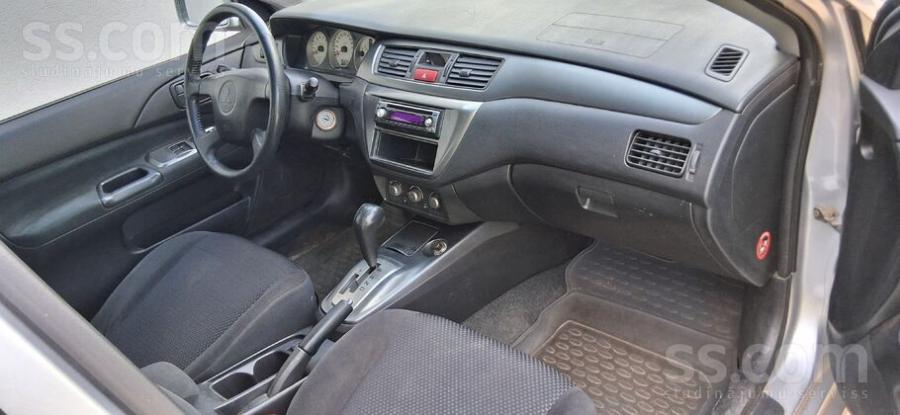 Pelēks Mitsubishi Lancer 2005 Rīga, ar dzinēja tilpumu 1.60 L un nobraukumu 180 tūkst. km par 1400 €, foto 16 vietnē AUTOMOTO.COM.LV