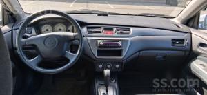 Pelēks Mitsubishi Lancer 2005 Rīga, ar dzinēja tilpumu 1.60 L un nobraukumu 180 tūkst. km par 1400 €, foto 18 vietnē AUTOMOTO.COM.LV