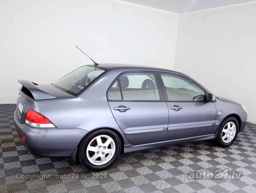 Pelēks Mitsubishi Lancer 2005 Tallina, ar dzinēja tilpumu 1.60 L un nobraukumu 119 tūkst. km par 1699 €, foto 4 vietnē AUTOMOTO.COM.LV