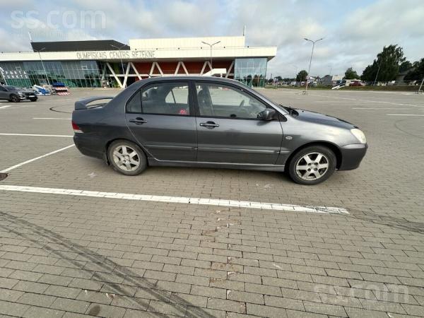 Pelēks Mitsubishi Lancer 2005 Rēzekne, ar dzinēja tilpumu 1.60 L un nobraukumu 258 tūkst. km par 800 €, foto 2 vietnē AUTOMOTO.COM.LV