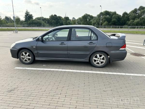 Pelēks Mitsubishi Lancer 2005 Rēzekne, ar dzinēja tilpumu 1.60 L un nobraukumu 258 tūkst. km par 800 €, foto 3 vietnē AUTOMOTO.COM.LV