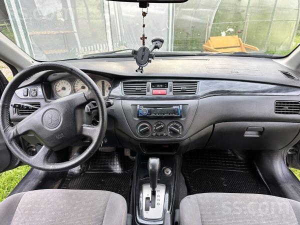 Pelēks Mitsubishi Lancer 2005 Rēzekne, ar dzinēja tilpumu 1.60 L un nobraukumu 258 tūkst. km par 800 €, foto 6 vietnē AUTOMOTO.COM.LV