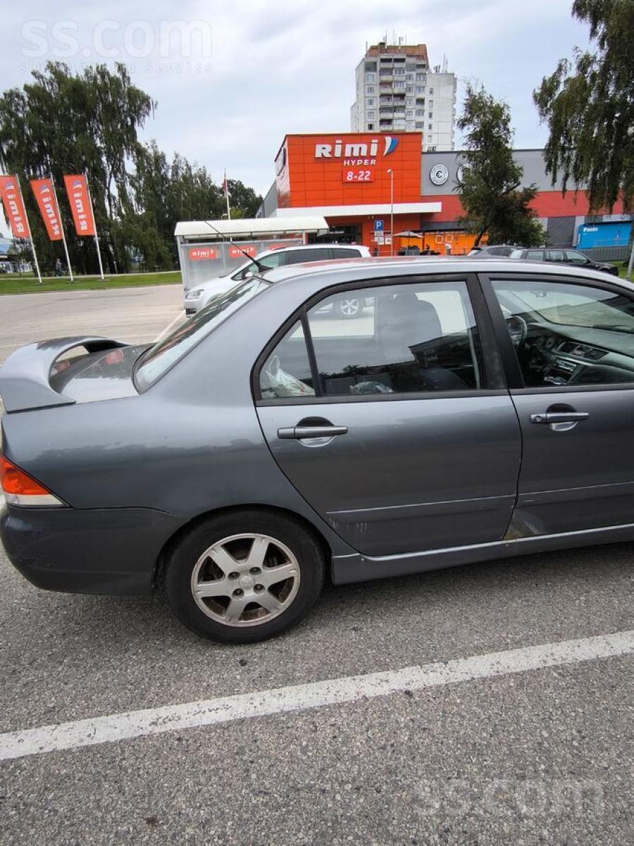 Grey Mitsubishi Lancer 2006 in Riga, with an engine capacity of 1.60 L and mileage of 160 thousand km for 700 €, photo 6 on AUTOMOTO.COM.LV
