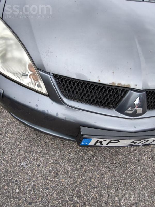 Grey Mitsubishi Lancer 2006 in Riga, with an engine capacity of 1.60 L and mileage of 160 thousand km for 700 €, photo 9 on AUTOMOTO.COM.LV