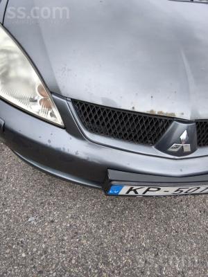 Grey Mitsubishi Lancer 2006 in Riga, with an engine capacity of 1.60 L and mileage of 160 thousand km for 700 €, photo 10 on AUTOMOTO.COM.LV