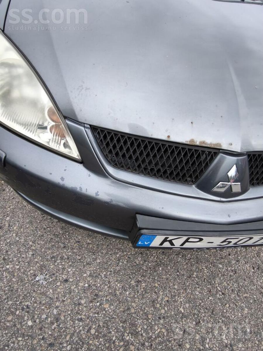 Grey Mitsubishi Lancer 2006 in Riga, with an engine capacity of 1.60 L and mileage of 160 thousand km for 700 €, photo 10 on AUTOMOTO.COM.LV