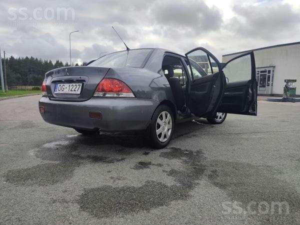 Grey Mitsubishi Lancer 2007 in Riga, with an engine capacity of 1.60 L and mileage of 254 thousand km for 1650 €, photo 8 on AUTOMOTO.COM.LV