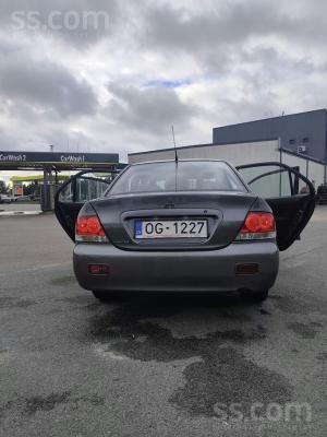 Grey Mitsubishi Lancer 2007 in Riga, with an engine capacity of 1.60 L and mileage of 254 thousand km for 1450 €, photo 12 on AUTOMOTO.COM.LV
