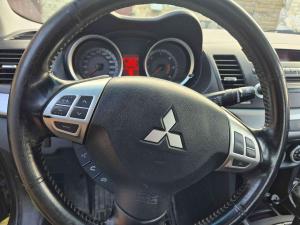 Grey Mitsubishi Lancer 2008 in Pakruojis, with an engine capacity of 1.97 L and mileage of 235 thousand km for 1850 €, photo 12 on AUTOMOTO.COM.LV