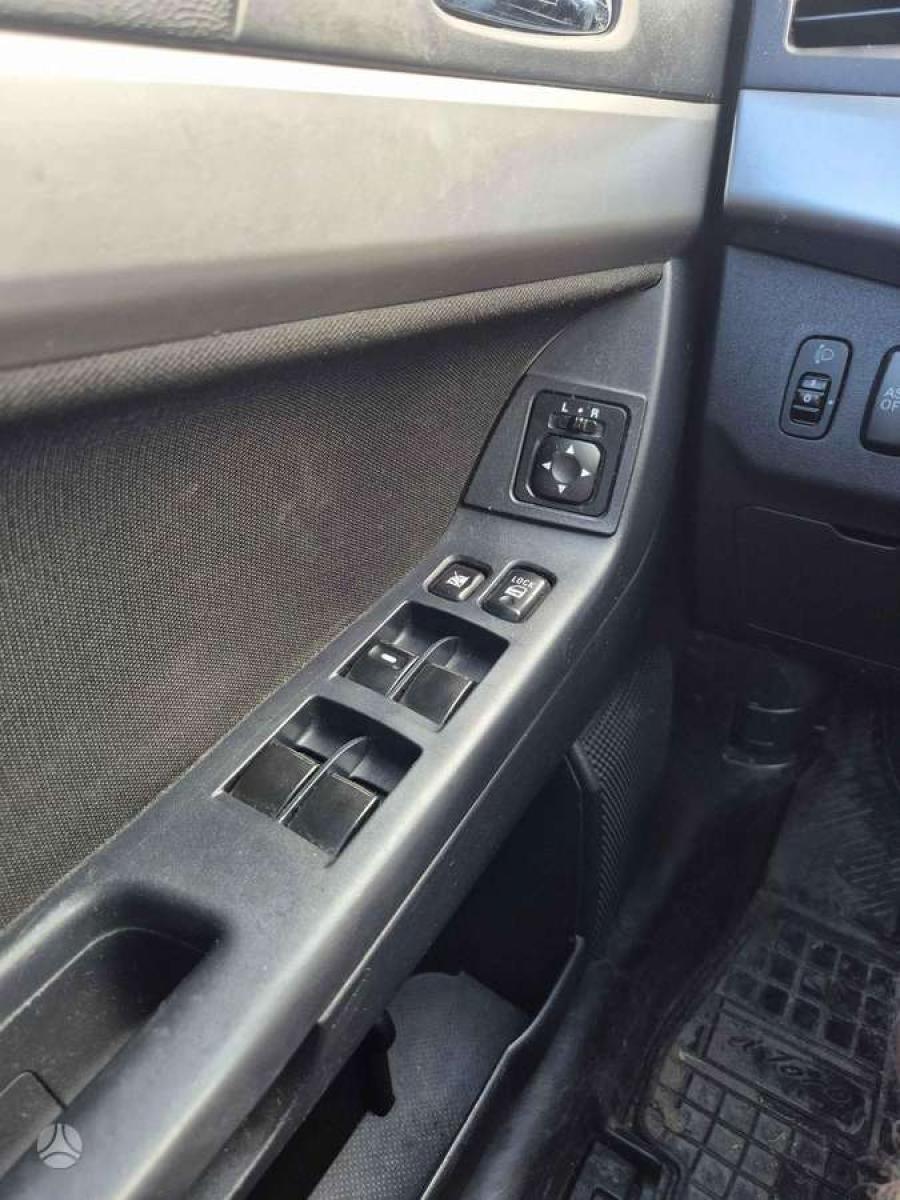 Grey Mitsubishi Lancer 2008 in Pakruojis, with an engine capacity of 1.97 L and mileage of 235 thousand km for 1850 €, photo 13 on AUTOMOTO.COM.LV
