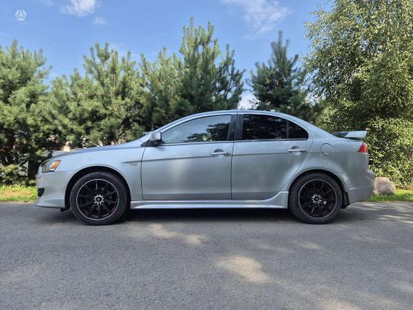 Pelēks Mitsubishi Lancer 2008 Viļņa, ar dzinēja tilpumu 1.80 L un nobraukumu 200 tūkst. km par 1950 €, foto 2 vietnē AUTOMOTO.COM.LV