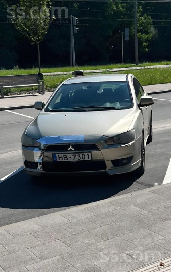 Pelēks Mitsubishi Lancer 2008 Rīga, ar dzinēja tilpumu 1.80 L un nobraukumu 243 tūkst. km par 800 €, foto 1 vietnē AUTOMOTO.COM.LV