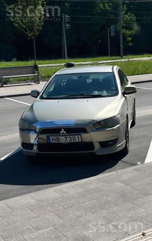 Pelēks Mitsubishi Lancer 2008 Rīga, ar dzinēja tilpumu 1.80 L un nobraukumu 243 tūkst. km par 800 €, foto  vietnē AUTOMOTO.COM.LV