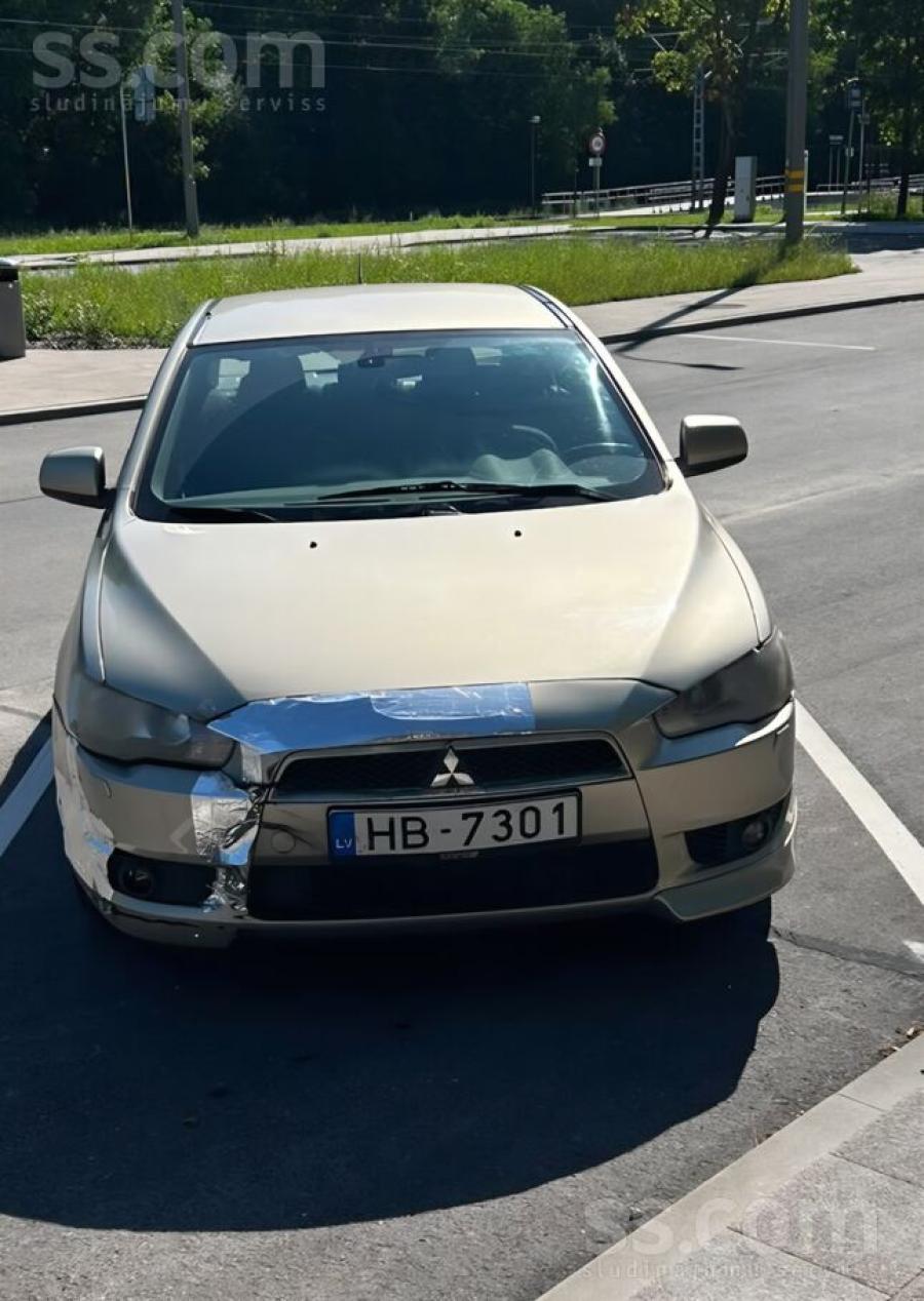 Pelēks Mitsubishi Lancer 2008 Rīga, ar dzinēja tilpumu 1.80 L un nobraukumu 243 tūkst. km par 800 €, foto 5 vietnē AUTOMOTO.COM.LV