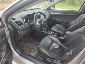 Grey Mitsubishi Lancer 2010 in Vilnius, with an engine capacity of 1.97 L and mileage of 204 thousand km for 1750 €, photo 13 on AUTOMOTO.COM.LV