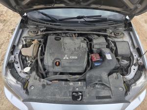 Grey Mitsubishi Lancer 2010 in Vilnius, with an engine capacity of 1.97 L and mileage of 204 thousand km for 1750 €, photo 16 on AUTOMOTO.COM.LV