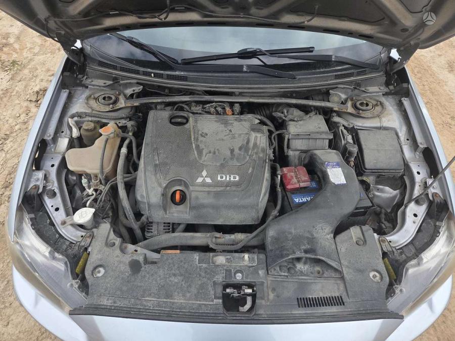 Grey Mitsubishi Lancer 2010 in Vilnius, with an engine capacity of 1.97 L and mileage of 204 thousand km for 1750 €, photo 16 on AUTOMOTO.COM.LV