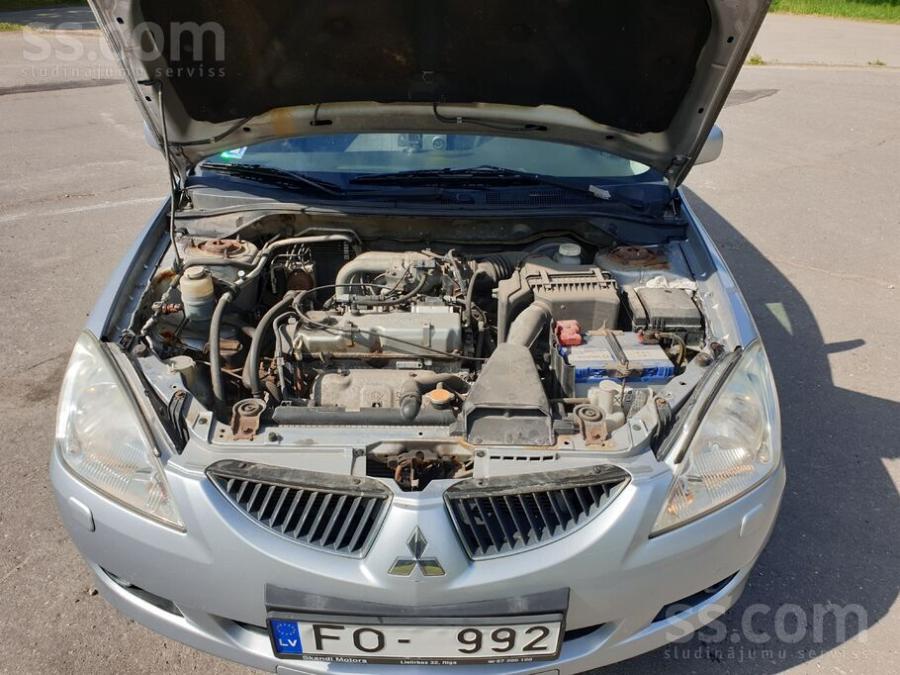 Grey Mitsubishi Lancer 2005 in Riga, with an engine capacity of 1.60 L and mileage of 130 thousand km for 1500 €, photo 9 on AUTOMOTO.COM.LV