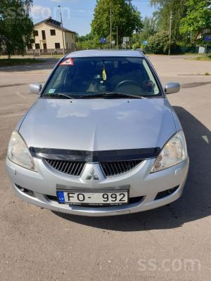 Pelēks Mitsubishi Lancer 2005 Rīga, ar dzinēja tilpumu 1.60 L un nobraukumu 130 tūkst. km par 1500 €, foto 5 vietnē AUTOMOTO.COM.LV