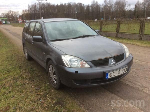 Grey Mitsubishi Lancer 2006 in Riga, with an engine capacity of 1.60 L and mileage of 218 thousand km for 1150 €, photo 4 on AUTOMOTO.COM.LV