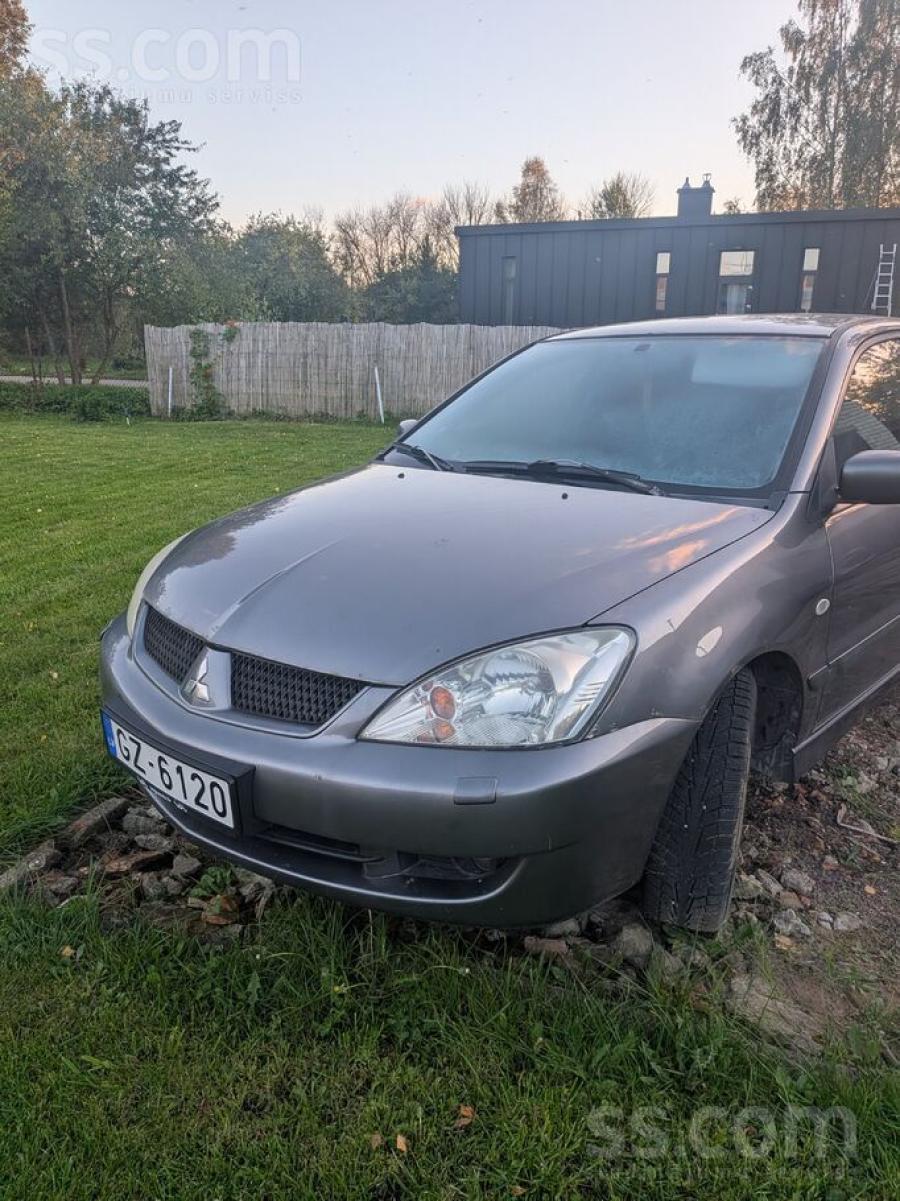 Grey Mitsubishi Lancer 2007 in Riga, with an engine capacity of 1.60 L and mileage of 232 thousand km for 500 €, photo 1 on AUTOMOTO.COM.LV