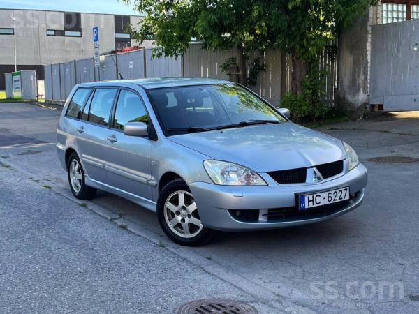 Grey Mitsubishi Lancer 2008 in Riga, with an engine capacity of 1.60 L and mileage of 199 thousand km for 1350 €, photo 2 on AUTOMOTO.COM.LV
