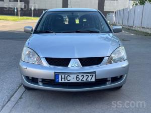 Grey Mitsubishi Lancer 2008 in Riga, with an engine capacity of 1.60 L and mileage of 199 thousand km for 1350 €, photo 5 on AUTOMOTO.COM.LV