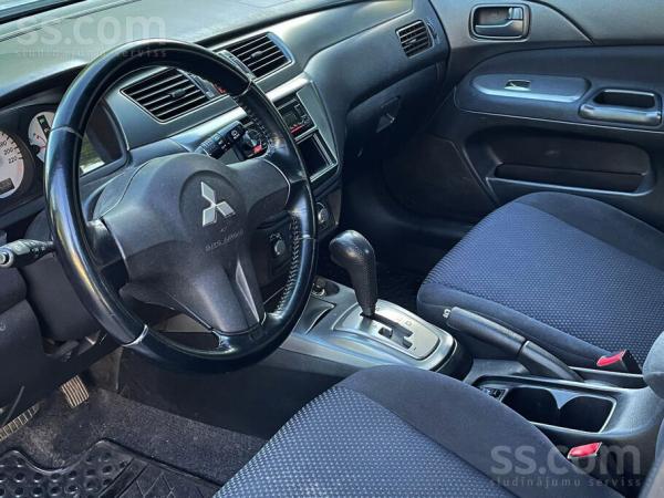 Grey Mitsubishi Lancer 2008 in Riga, with an engine capacity of 1.60 L and mileage of 199 thousand km for 1350 €, photo 8 on AUTOMOTO.COM.LV