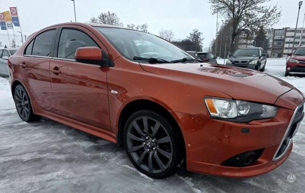 Orange Mitsubishi Lancer 2010 in Marijampole, with an engine capacity of 2.00 L and mileage of 277 thousand km for 6950 €, photo 1 on AUTOMOTO.COM.LV