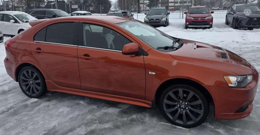 Orange Mitsubishi Lancer 2010 in Marijampole, with an engine capacity of 2.00 L and mileage of 277 thousand km for 6950 €, photo 2 on AUTOMOTO.COM.LV