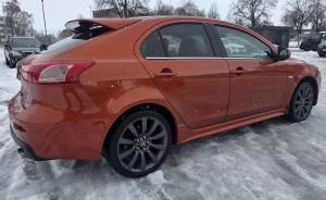 Orange Mitsubishi Lancer 2010 in Marijampole, with an engine capacity of 2.00 L and mileage of 277 thousand km for 6950 €, photo 3 on AUTOMOTO.COM.LV