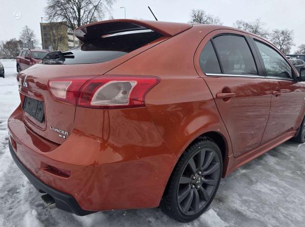 Orange Mitsubishi Lancer 2010 in Marijampole, with an engine capacity of 2.00 L and mileage of 277 thousand km for 6950 €, photo 4 on AUTOMOTO.COM.LV
