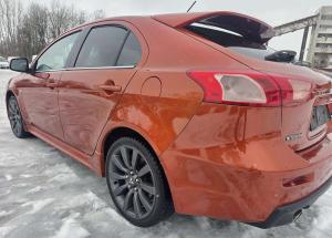 Orange Mitsubishi Lancer 2010 in Marijampole, with an engine capacity of 2.00 L and mileage of 277 thousand km for 6950 €, photo 5 on AUTOMOTO.COM.LV