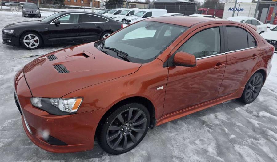 Orange Mitsubishi Lancer 2010 in Marijampole, with an engine capacity of 2.00 L and mileage of 277 thousand km for 6950 €, photo 7 on AUTOMOTO.COM.LV