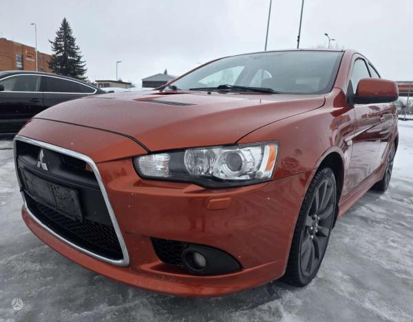 Orange Mitsubishi Lancer 2010 in Marijampole, with an engine capacity of 2.00 L and mileage of 277 thousand km for 6950 €, photo 8 on AUTOMOTO.COM.LV