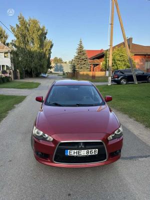 Red Mitsubishi Lancer 2009 in Vilnius, with an engine capacity of 1.80 L and mileage of 249 thousand km for 1950 €, photo 3 on AUTOMOTO.COM.LV