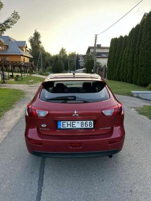 Red Mitsubishi Lancer 2009 in Vilnius, with an engine capacity of 1.80 L and mileage of 249 thousand km for 1950 €, photo 7 on AUTOMOTO.COM.LV