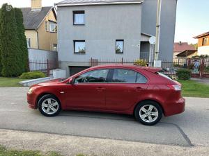 Red Mitsubishi Lancer 2009 in Vilnius, with an engine capacity of 1.80 L and mileage of 249 thousand km for 1950 €, photo 9 on AUTOMOTO.COM.LV