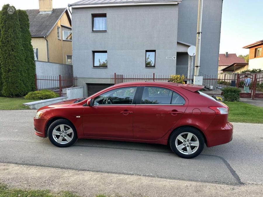 Red Mitsubishi Lancer 2009 in Vilnius, with an engine capacity of 1.80 L and mileage of 249 thousand km for 1950 €, photo 9 on AUTOMOTO.COM.LV