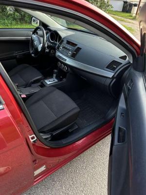 Red Mitsubishi Lancer 2009 in Vilnius, with an engine capacity of 1.80 L and mileage of 249 thousand km for 1950 €, photo 11 on AUTOMOTO.COM.LV