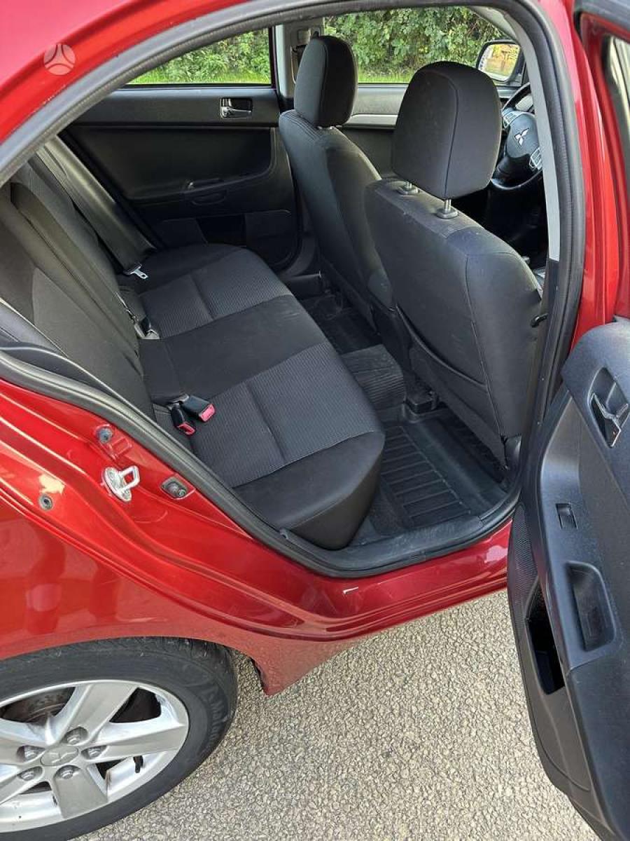 Red Mitsubishi Lancer 2009 in Vilnius, with an engine capacity of 1.80 L and mileage of 249 thousand km for 1950 €, photo 12 on AUTOMOTO.COM.LV