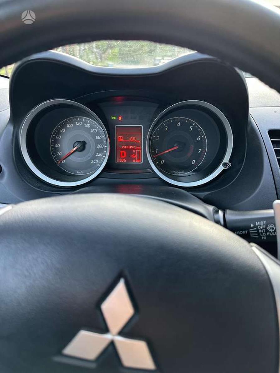 Red Mitsubishi Lancer 2009 in Vilnius, with an engine capacity of 1.80 L and mileage of 249 thousand km for 1950 €, photo 18 on AUTOMOTO.COM.LV