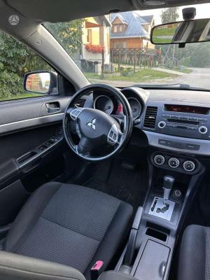 Red Mitsubishi Lancer 2009 in Vilnius, with an engine capacity of 1.80 L and mileage of 249 thousand km for 1950 €, photo 20 on AUTOMOTO.COM.LV
