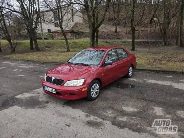 Sarkans Mitsubishi Lancer 2002 Marijampole, ar dzinēja tilpumu 2.00 L un nobraukumu 194 tūkst. km par 1800 €, foto 1 vietnē AUTOMOTO.COM.LV